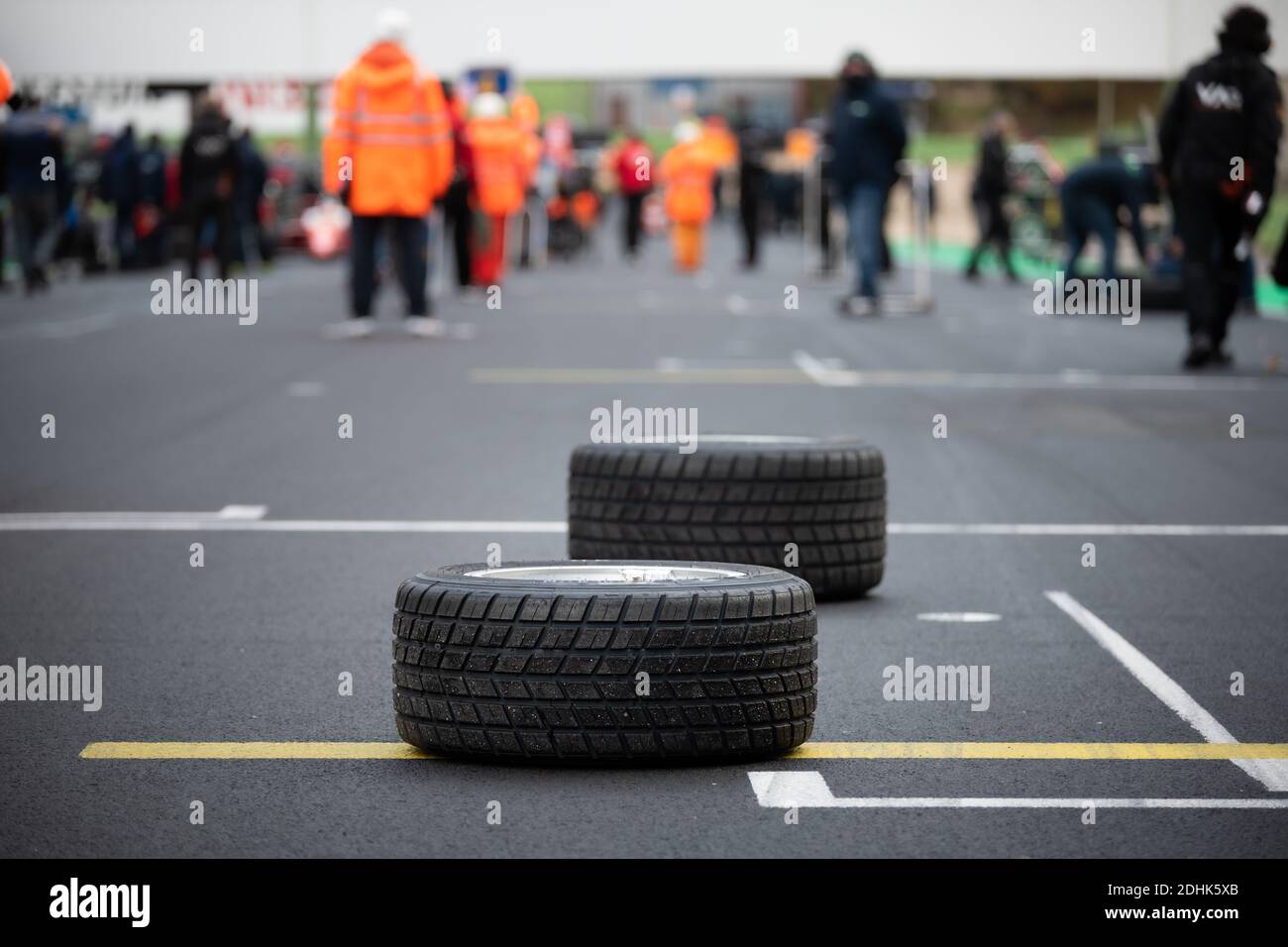 Wet race concept, motorsport car rain tires on asphalt circuit starting ...