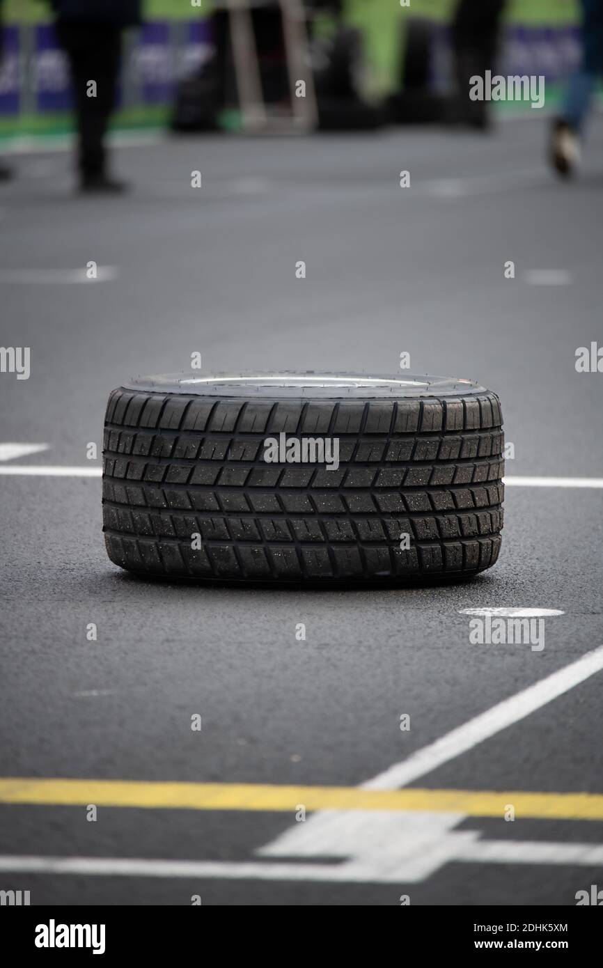 Wet race concept, motorsport car rain tires on asphalt circuit starting ...
