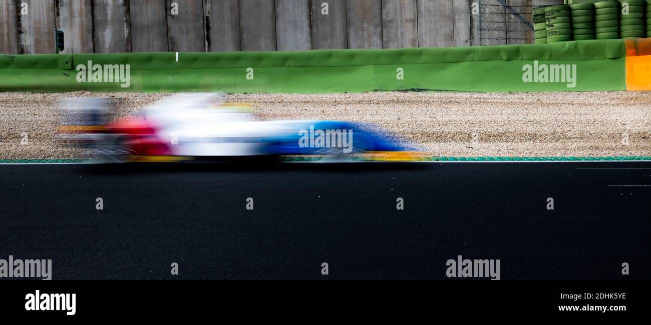 Speed concept blurred motion racing car on asphalt track side view ...