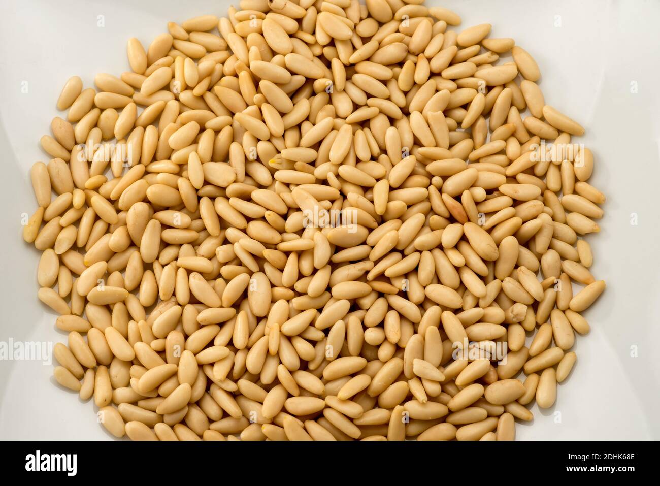 pine nuts, heap of seeds isolated on white background in top view Stock ...