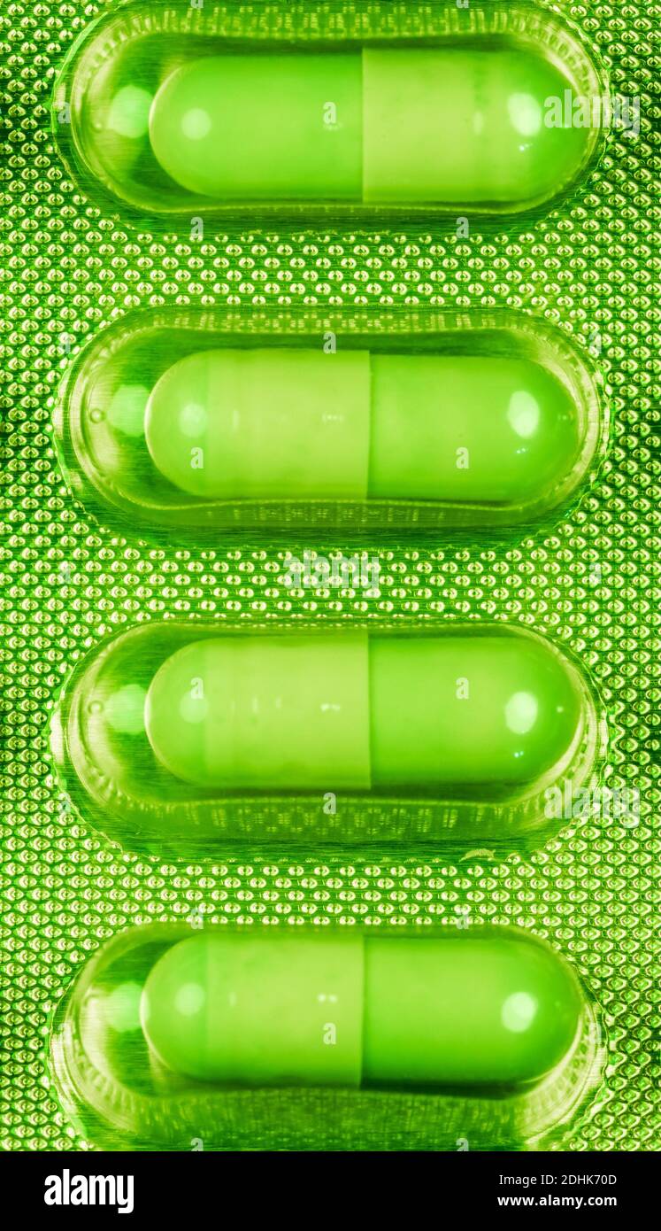 A top view shot of medical green capsules - concept of new normal Stock ...