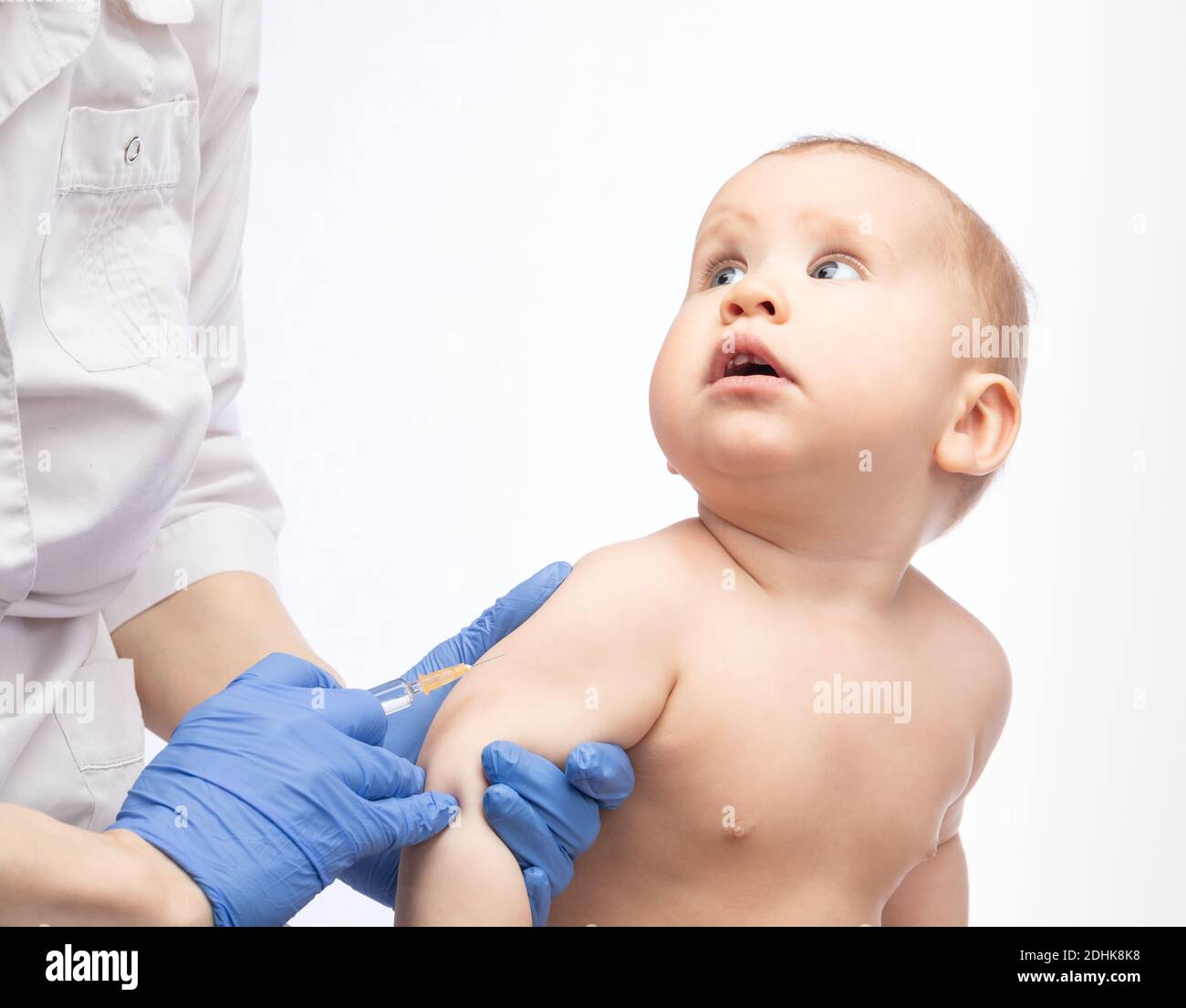 Pediatrician or nurse ready to give an intramuscular injection of a ...