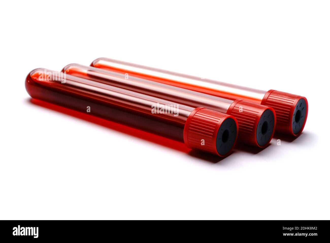 Test tubes with red plug isolated on white background Stock Photo - Alamy
