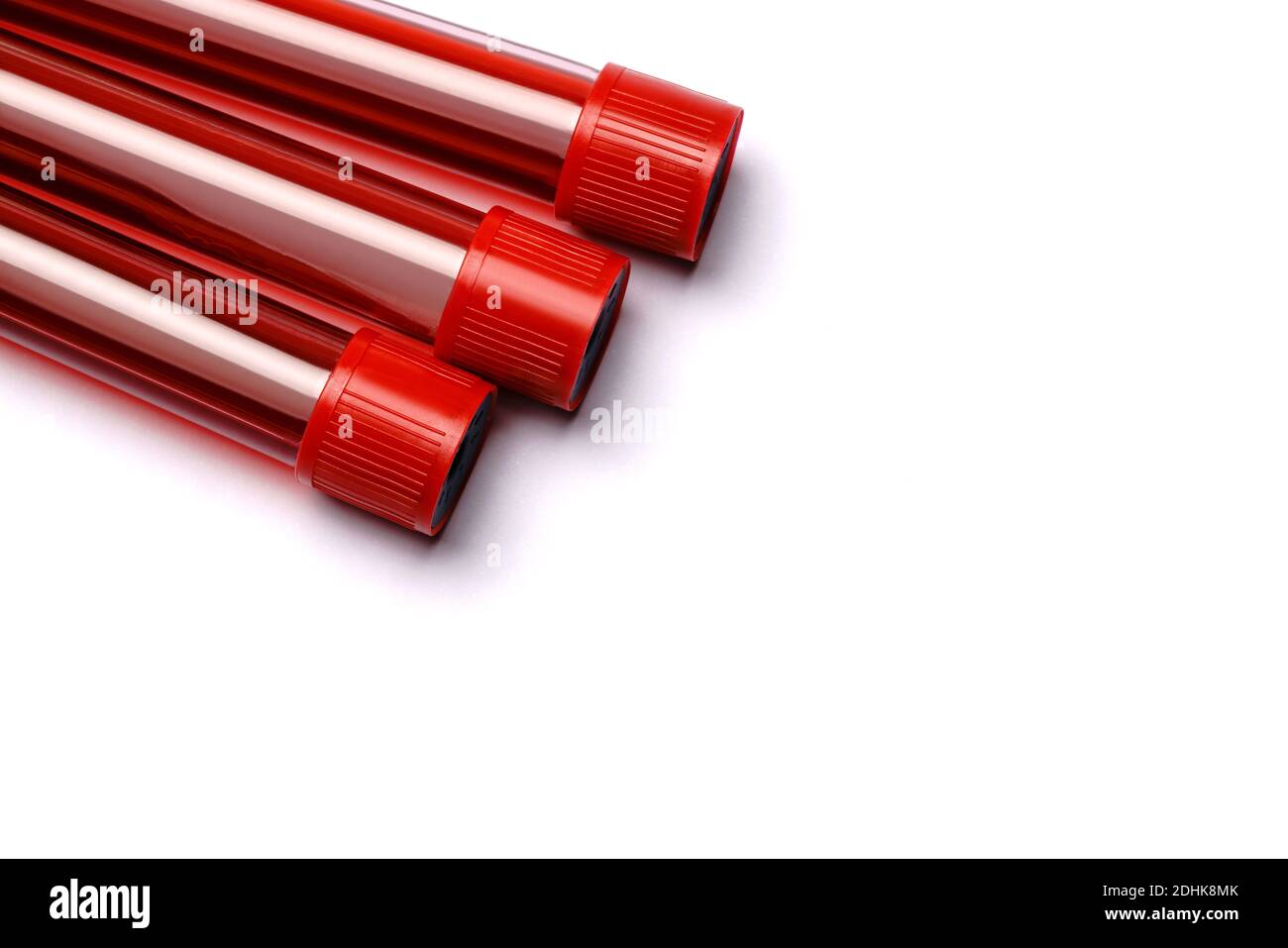 Test tubes with red plug isolated on white background Stock Photo - Alamy