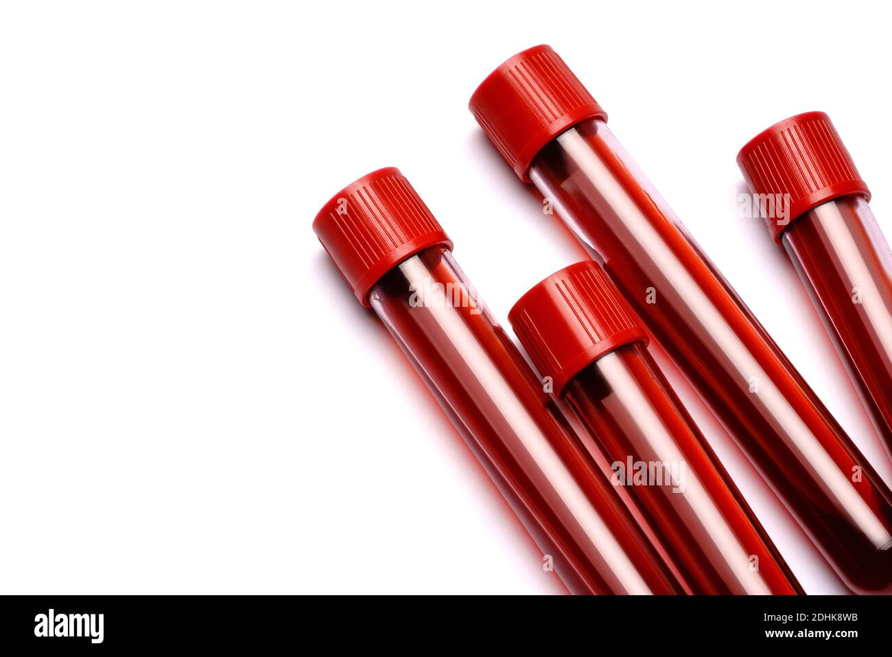 Test tubes with red plug isolated on white background Stock Photo - Alamy