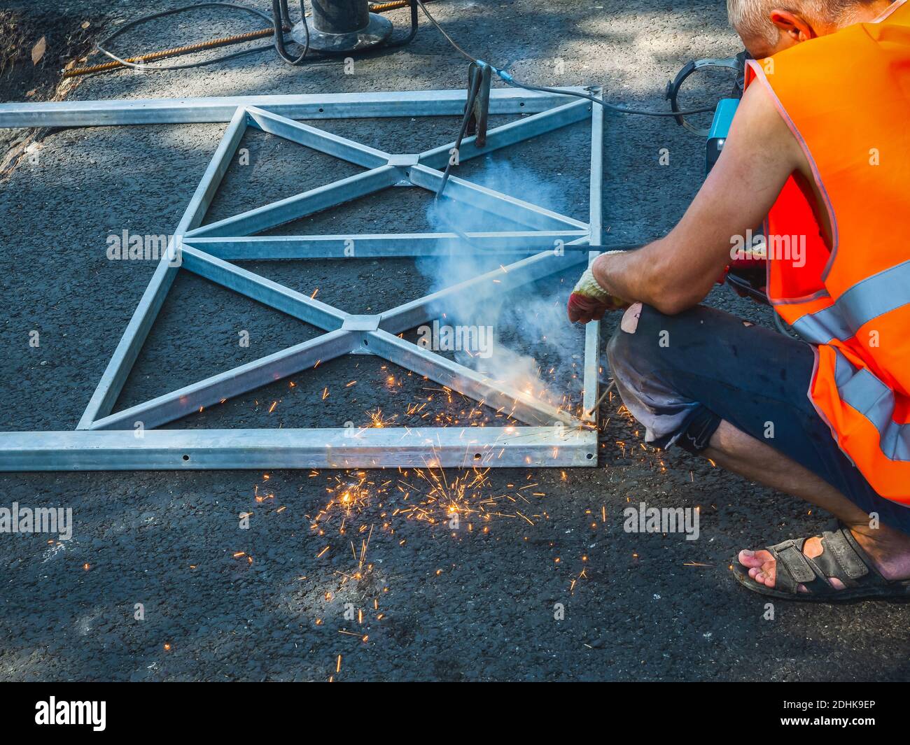 Construction worker in orange welding hi-res stock photography and ...