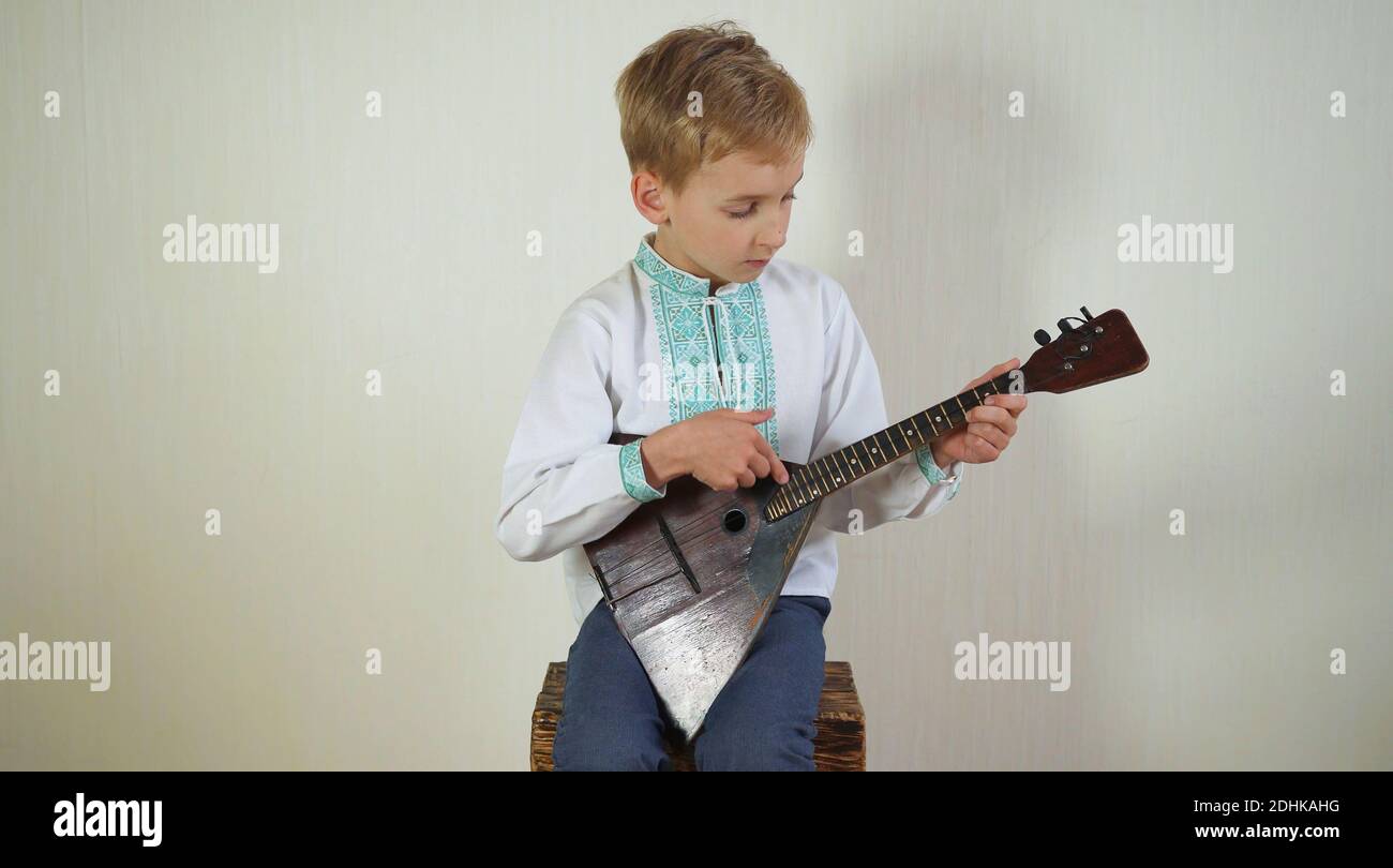Balalaika playing hi-res stock photography and images - Alamy