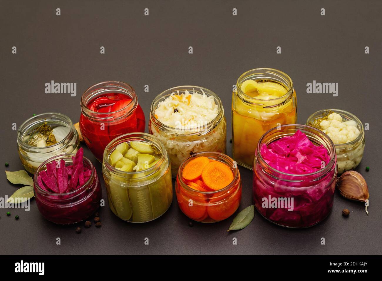 Assorted of fermented vegetables in glass jars. Preserved season ...