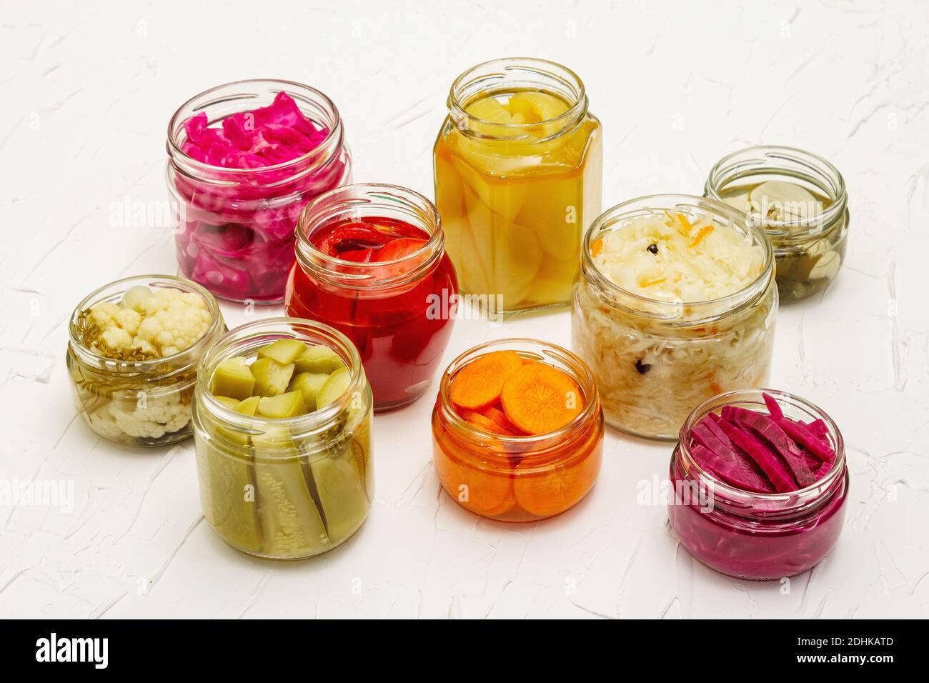 Assorted of fermented vegetables in glass jars. Preserved season ...