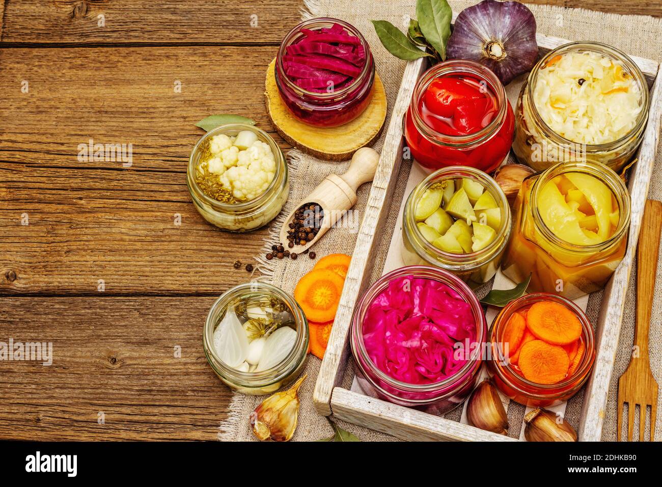 Assorted of fermented vegetables in glass jars. Preserved season ...