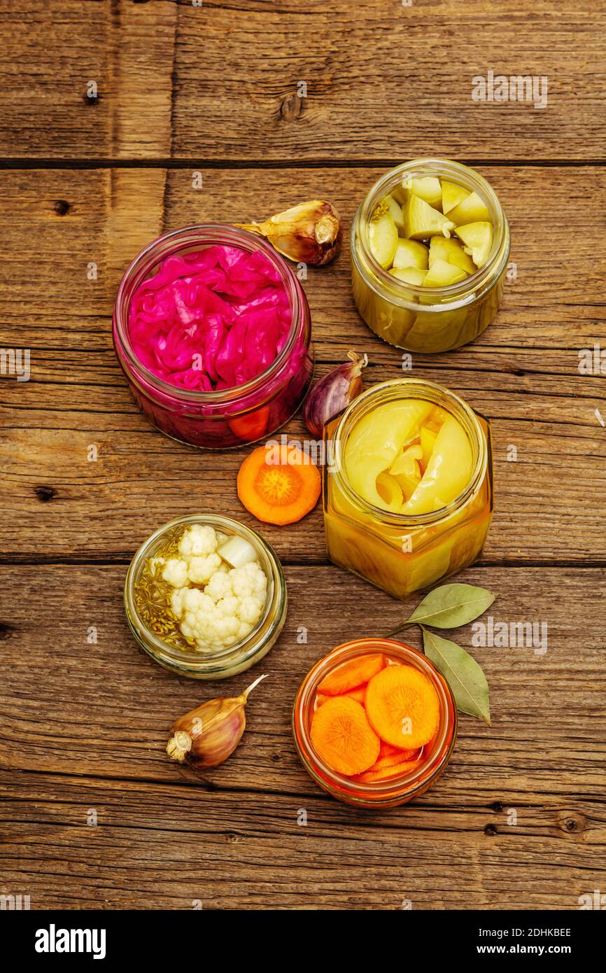 Assorted of fermented vegetables in glass jars. Preserved season ...