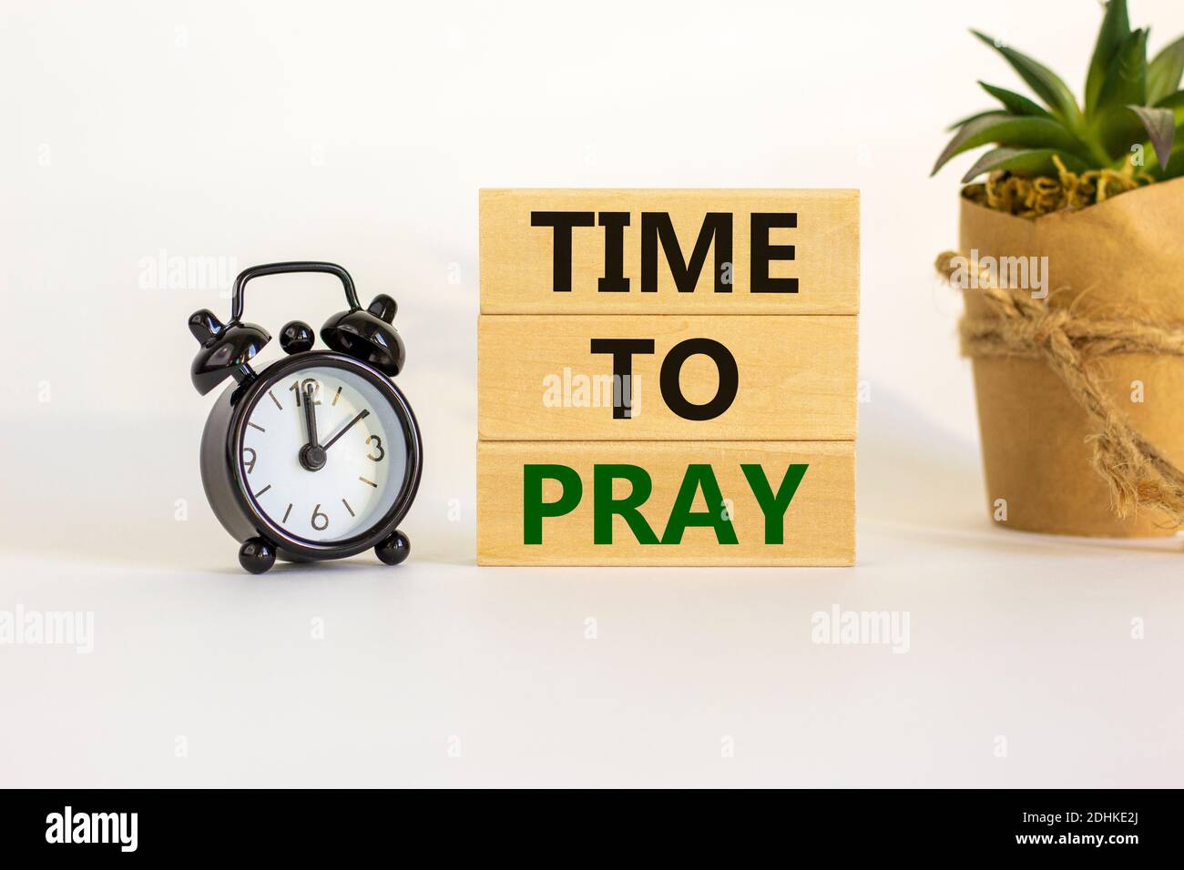 Time to pray symbol. Wooden blocks with words 'time to pray'. White ...