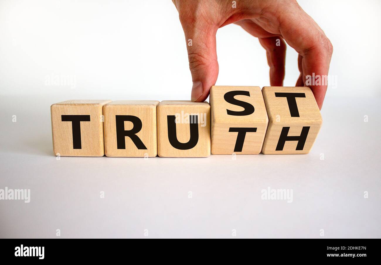 Truth or trust symbol. Male hand turns wooden cubes and changes the ...