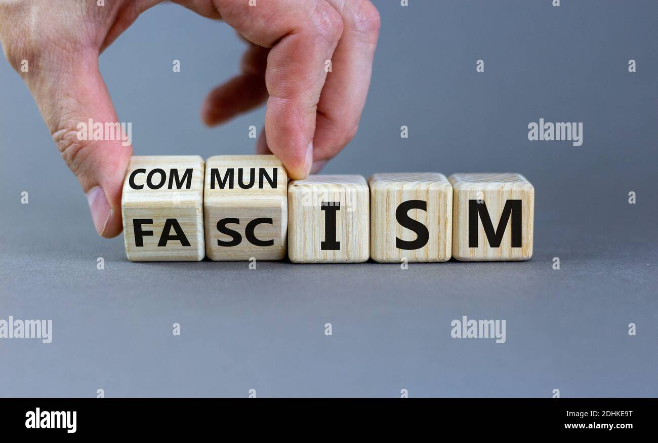 Communism or fascism symbol. Male hand turns cubes and changes the word ...