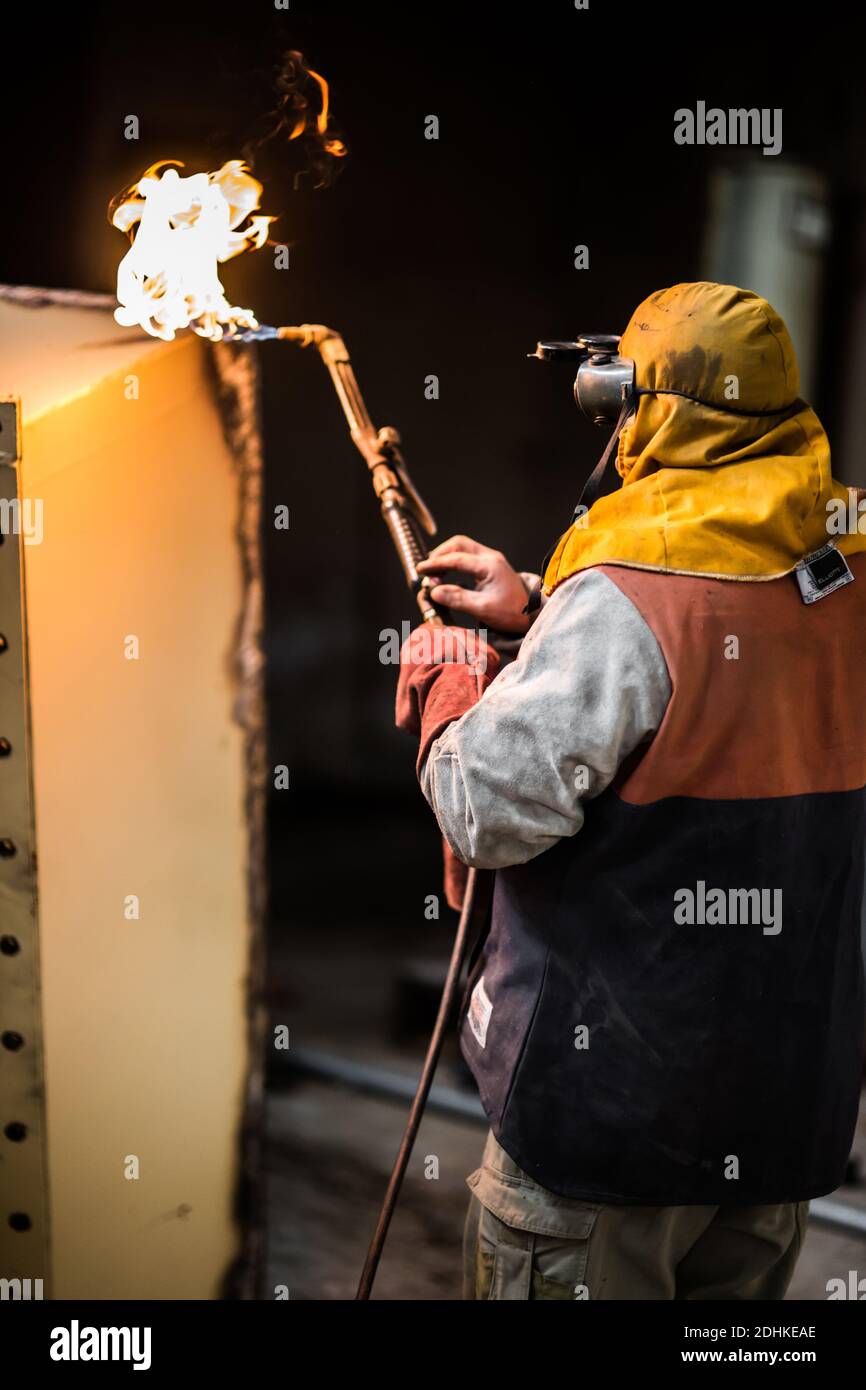 A vertical shot of a demolition construction worker with full ...