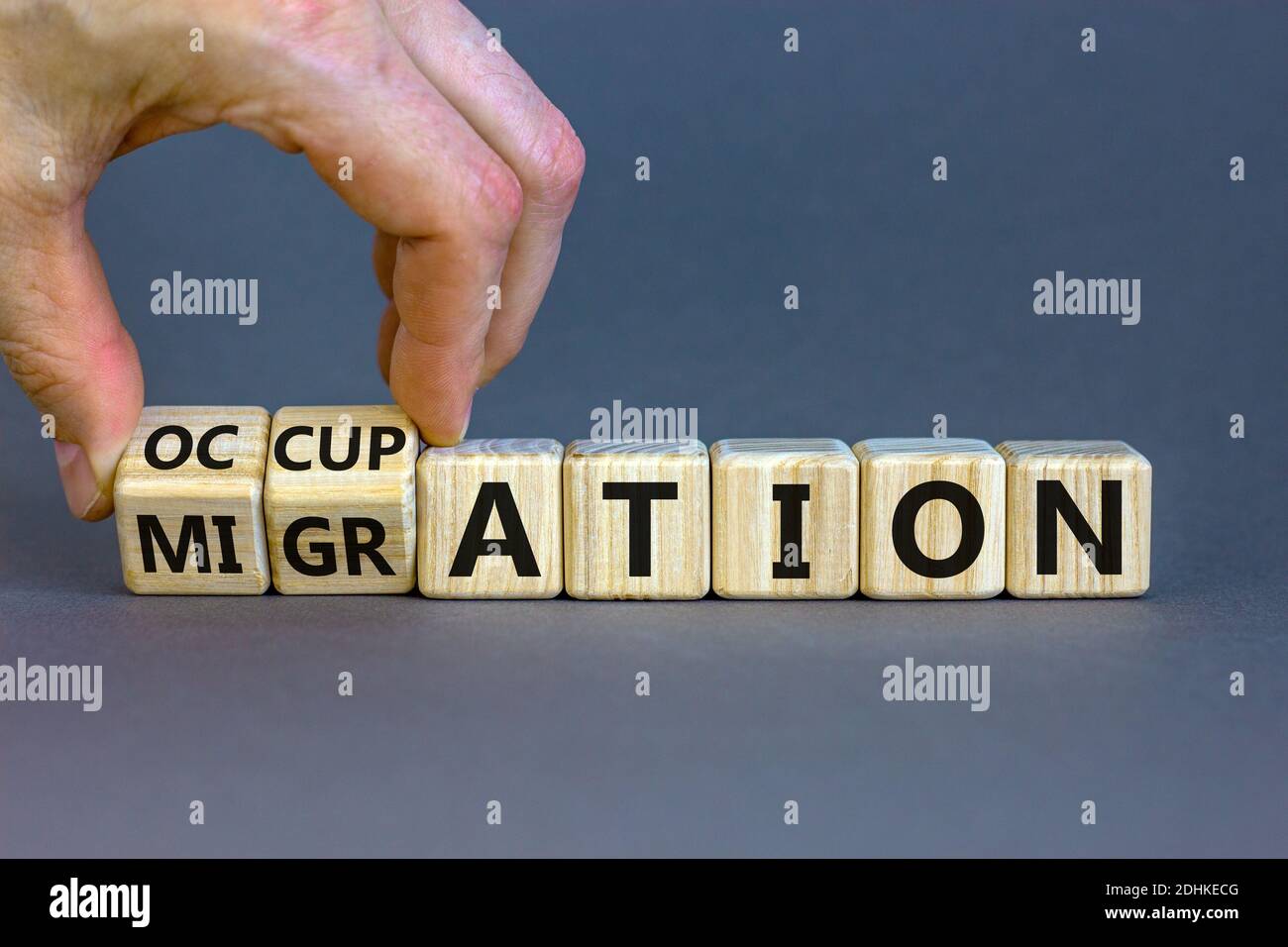 Migration or occupation symbol. Male hand turns cubes and changes the ...