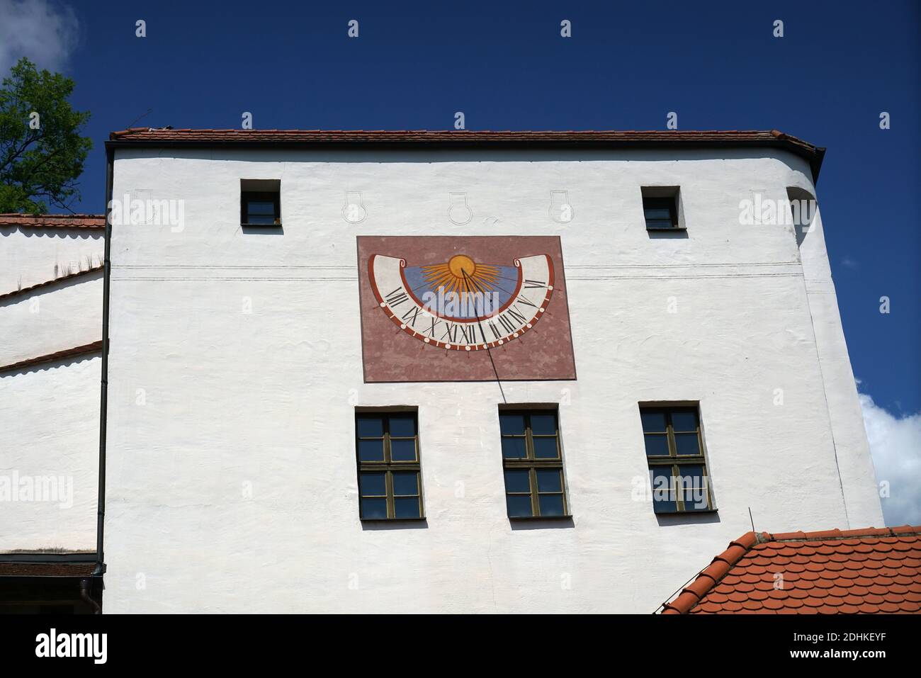 A low angle shot of a sundial on a restored building Stock Photo - Alamy