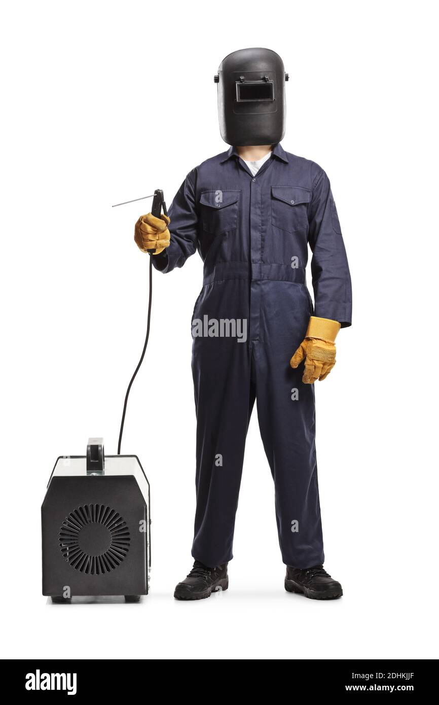 Full length portrait of a welder in a uniform with a welding generator ...