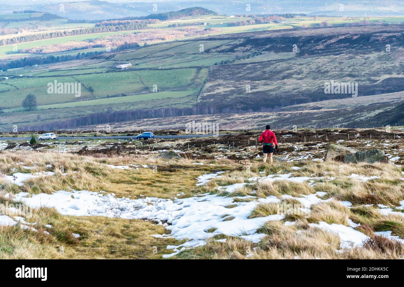 fell runner descends from meltham moor Stock Photo - Alamy