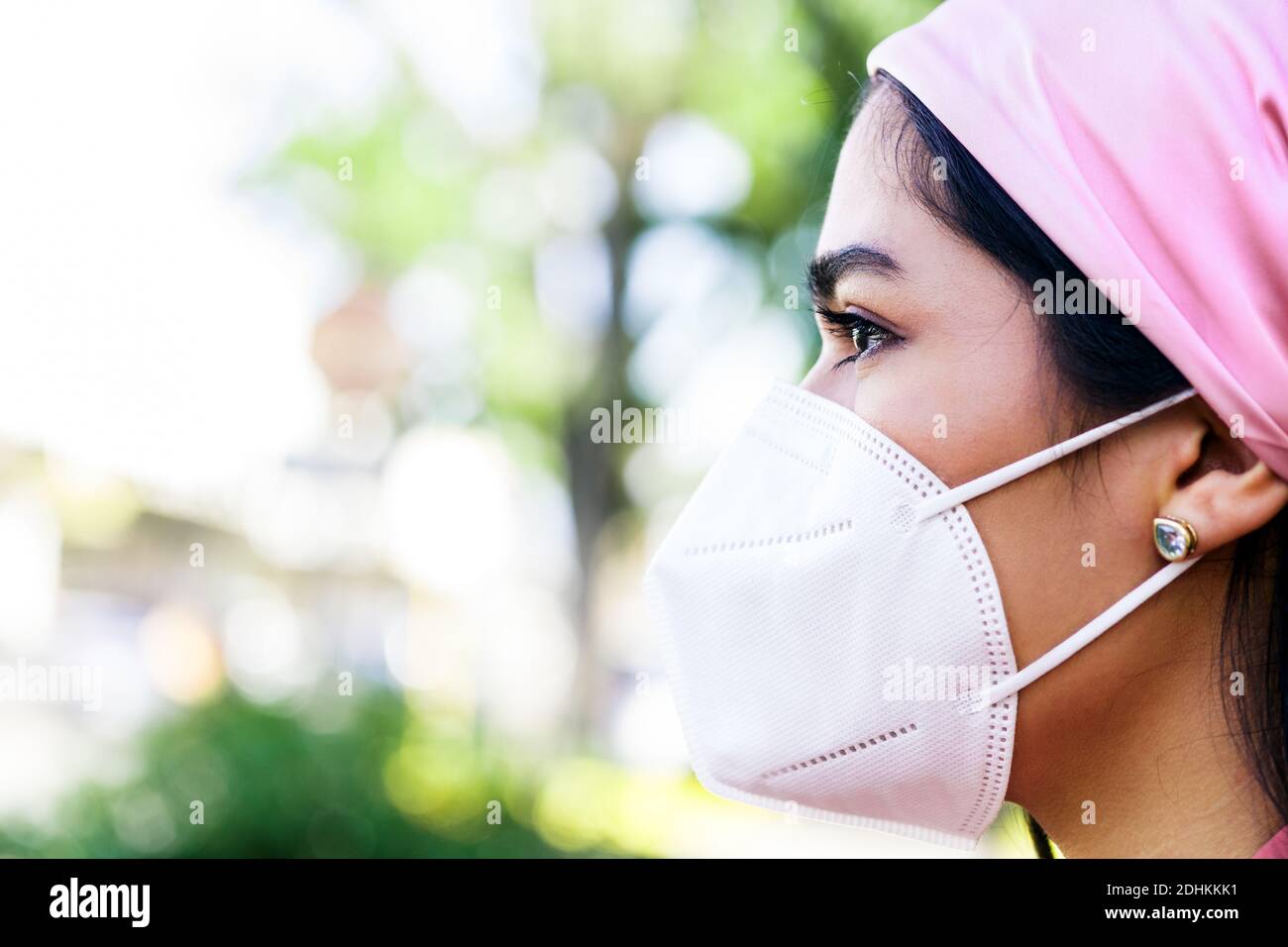 A shot of a woman in a protective mask - new normal Stock Photo - Alamy