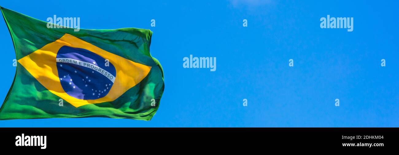 A panoramic shot of the Brazilian flag waving in the wind Stock Photo ...