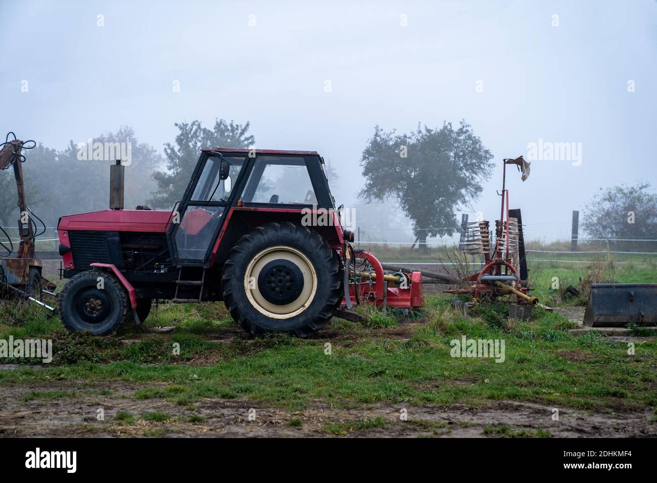 tractor on a farm in the countryside Stock Photo - Alamy