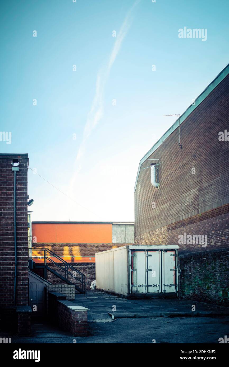 A shipping container in a yard between two buildings in Consett, County ...