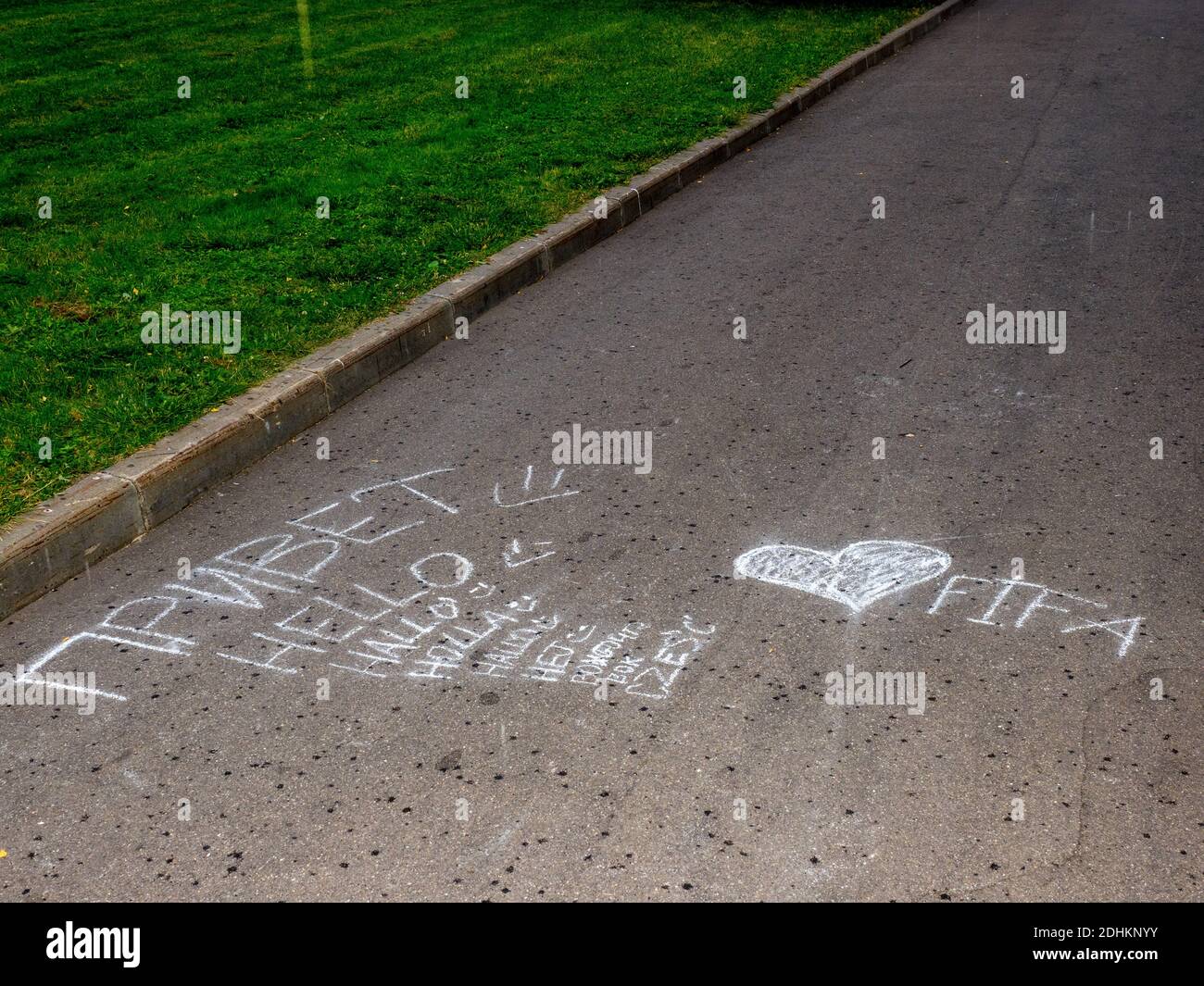 A greeting message written on the ground in chalk Stock Photo - Alamy