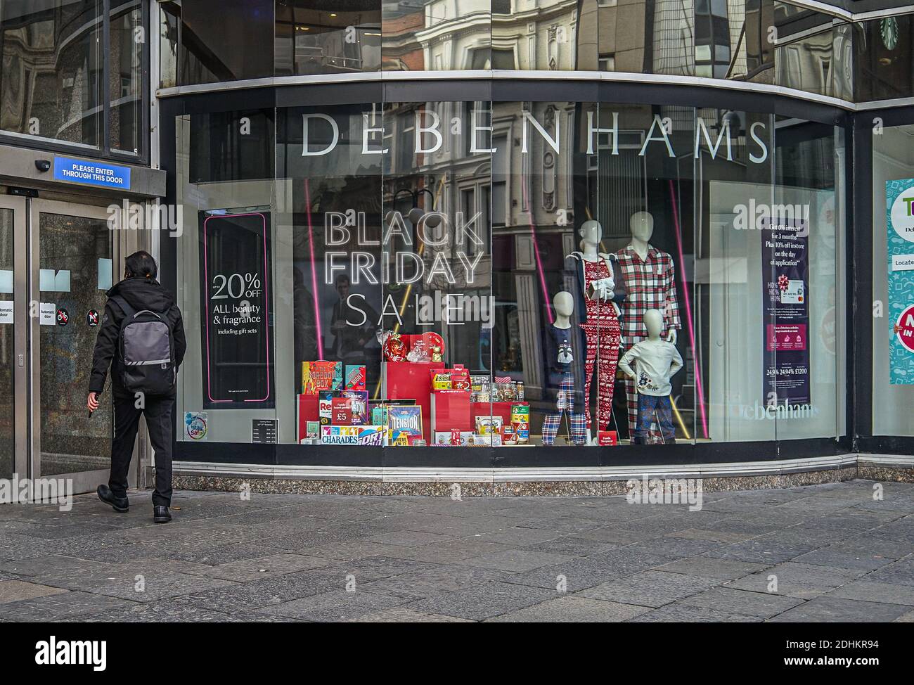 A shopper entering the Debenhams Store Stock Photo - Alamy