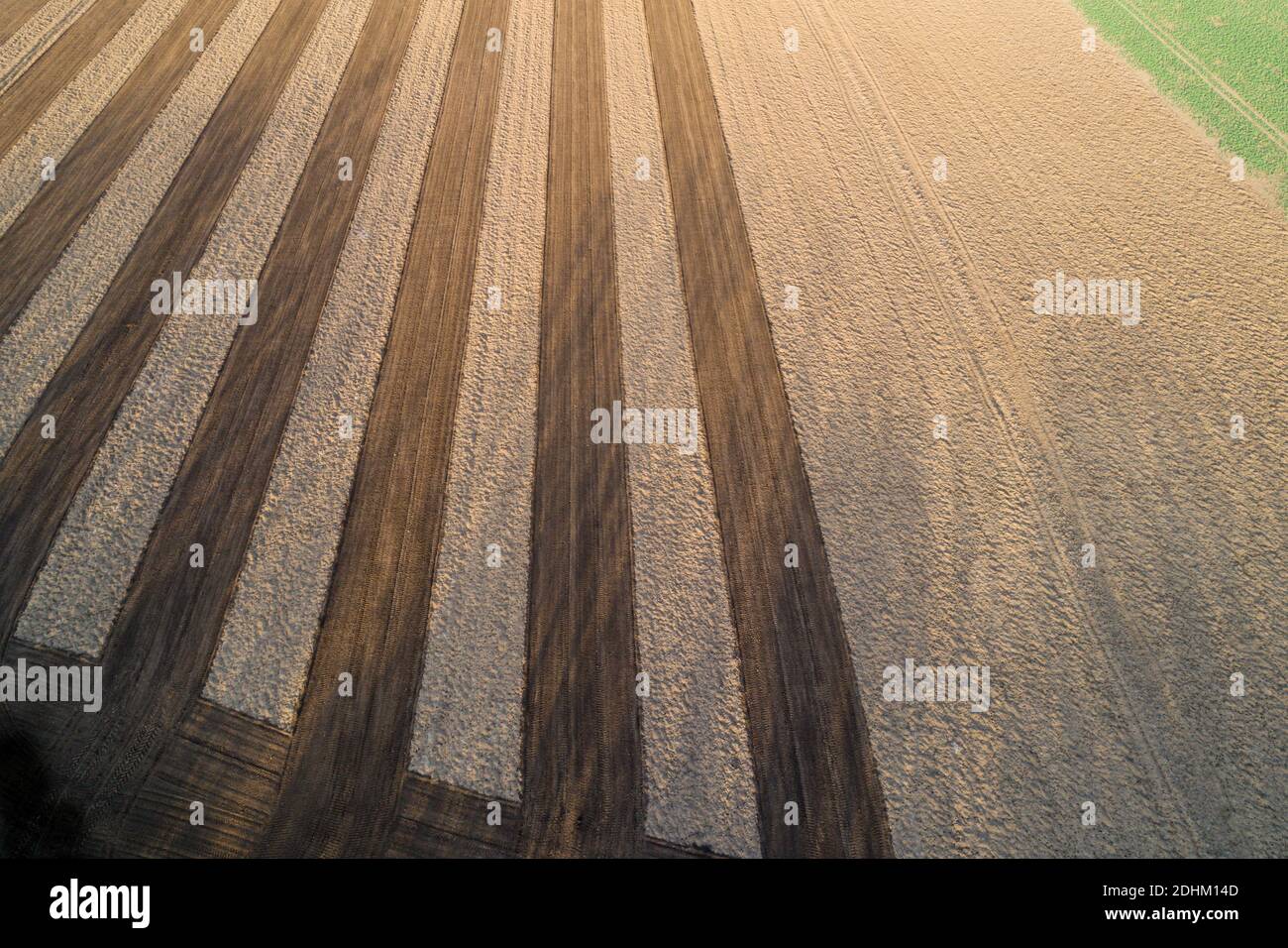 Aerial flight of field with tractor wheel track Stock Photo - Alamy