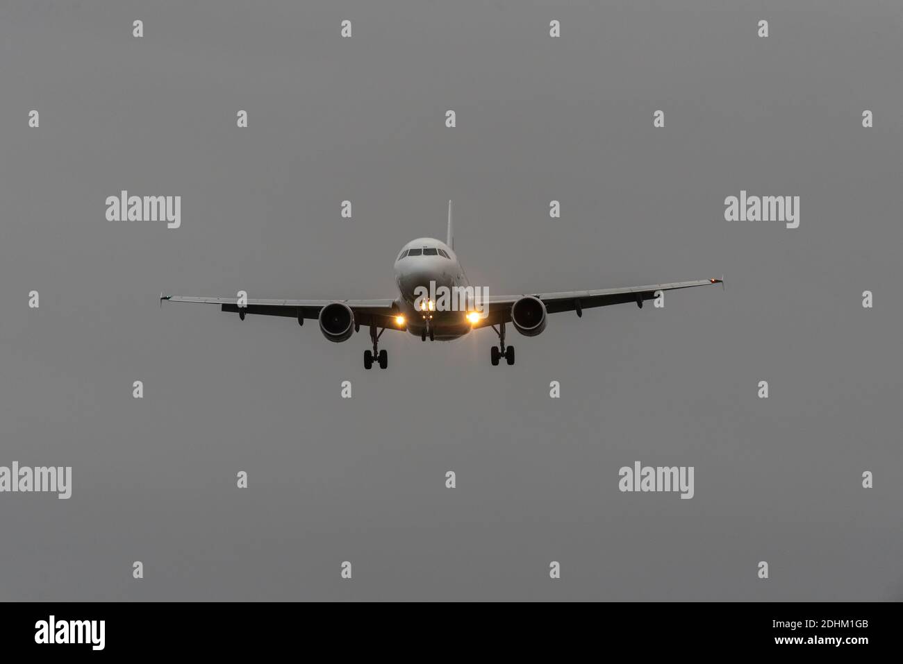 Early morning arrival. jet airliner plane on approach to land at London ...