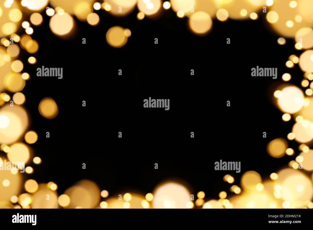 Yellow bokeh Christmas lights frame for overlay use. Yellow round spots ...