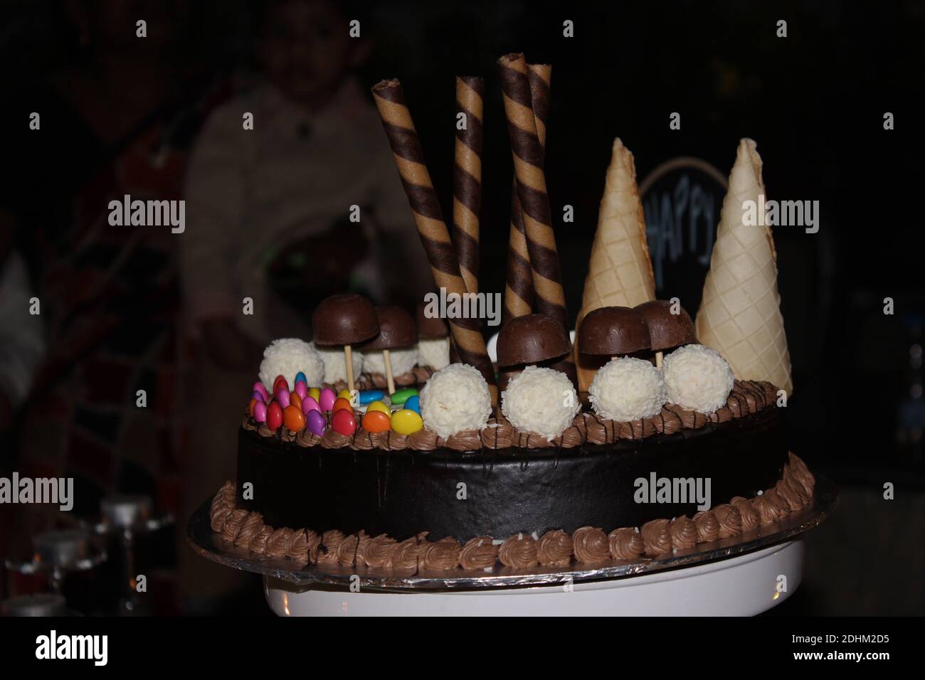a beautiful birthday cake made by chocolate garnish with chocolate ...