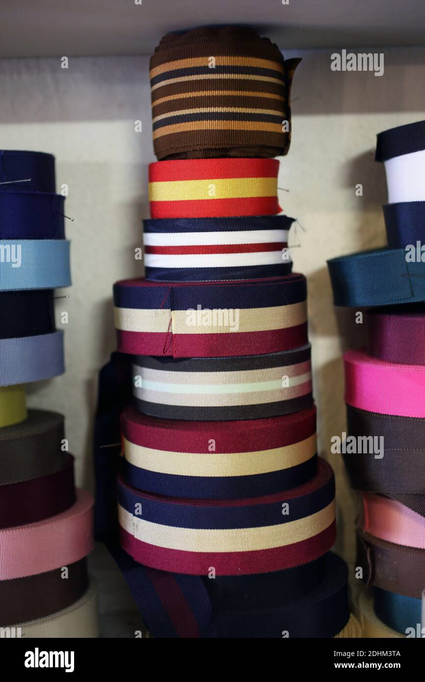 Stack of multicoloured ribbons of various widths, patterns and textures ...