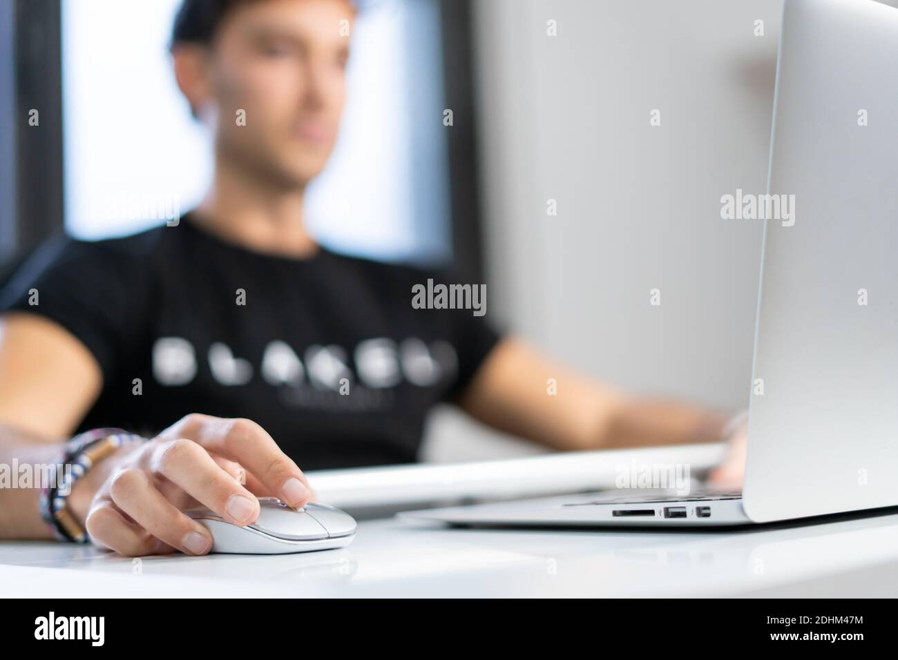 young entrepreneur works from home in his office with the computer in ...