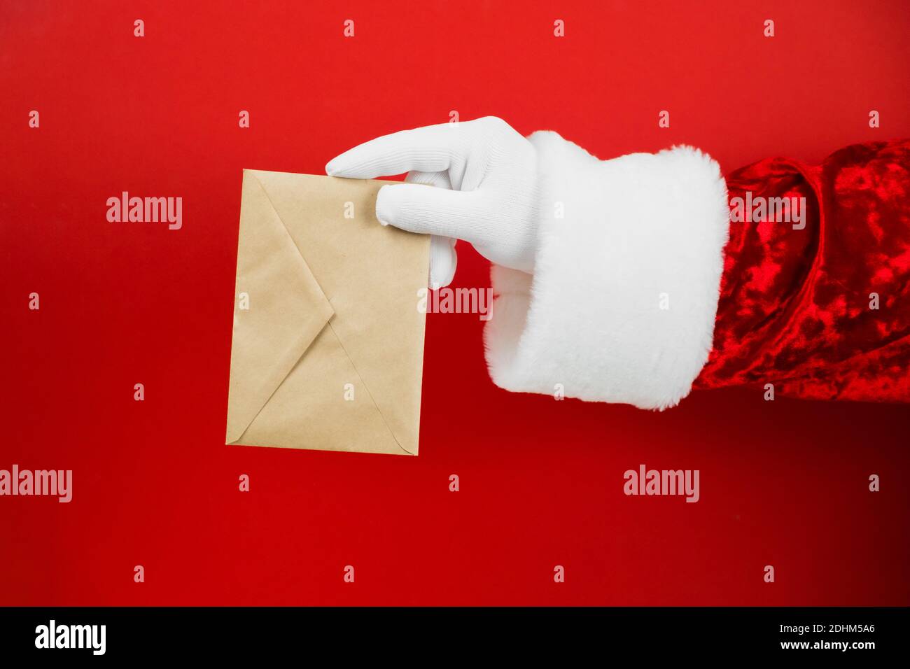 Santa Claus hand hold craft envelope with letter, sending post card ...