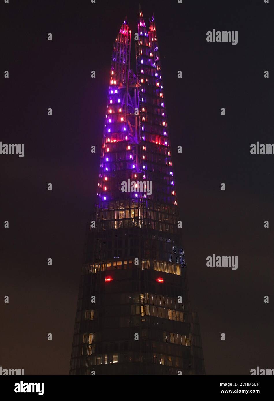 The top 20 storeys of the Shard building in central London are lit up ...