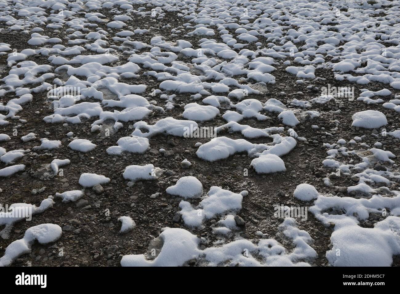 Frosty ground covered with white patches of snow Stock Photo - Alamy