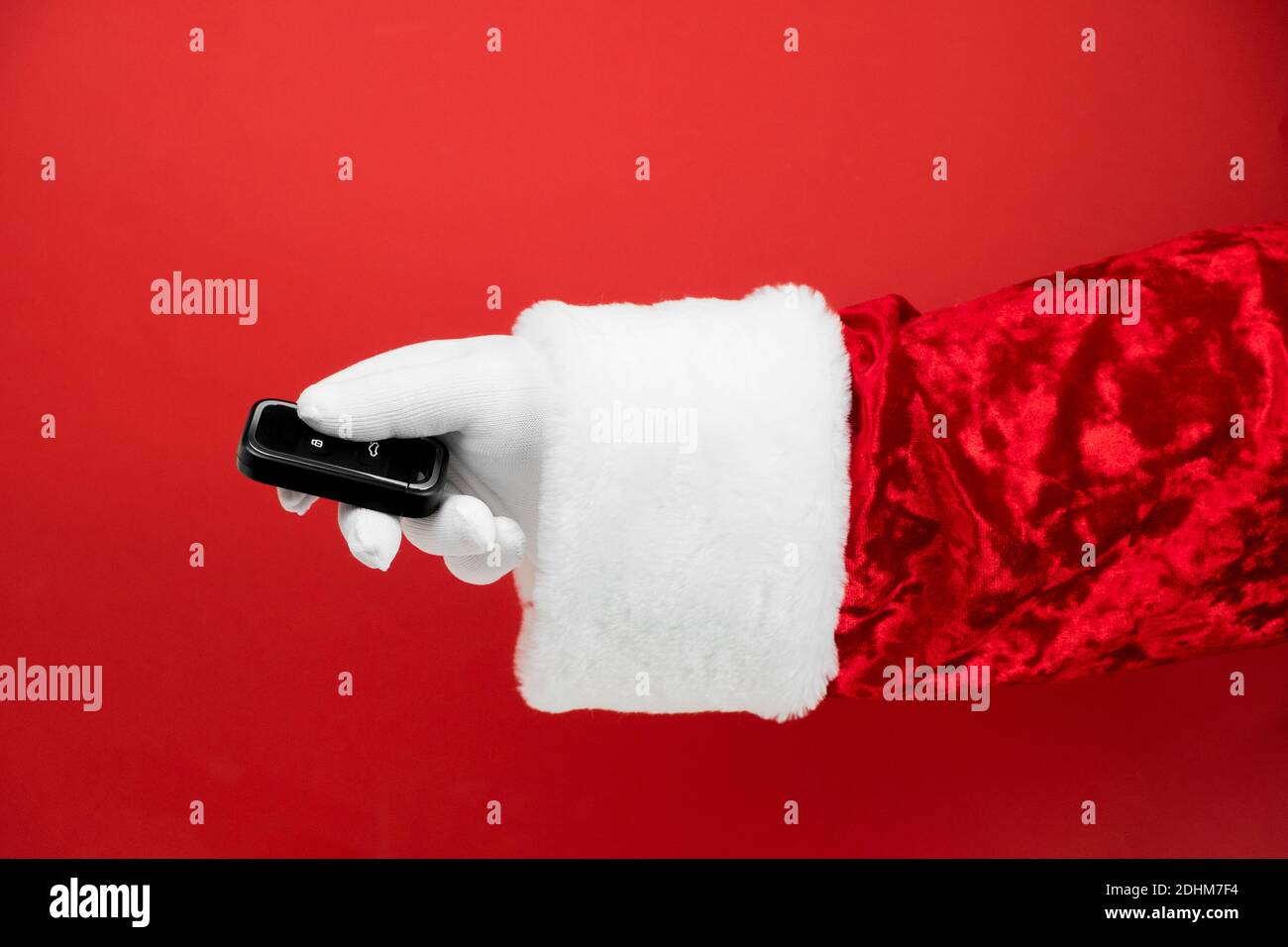 Santa Claus hand holds car keys. Merry Christmas and New Year concept ...