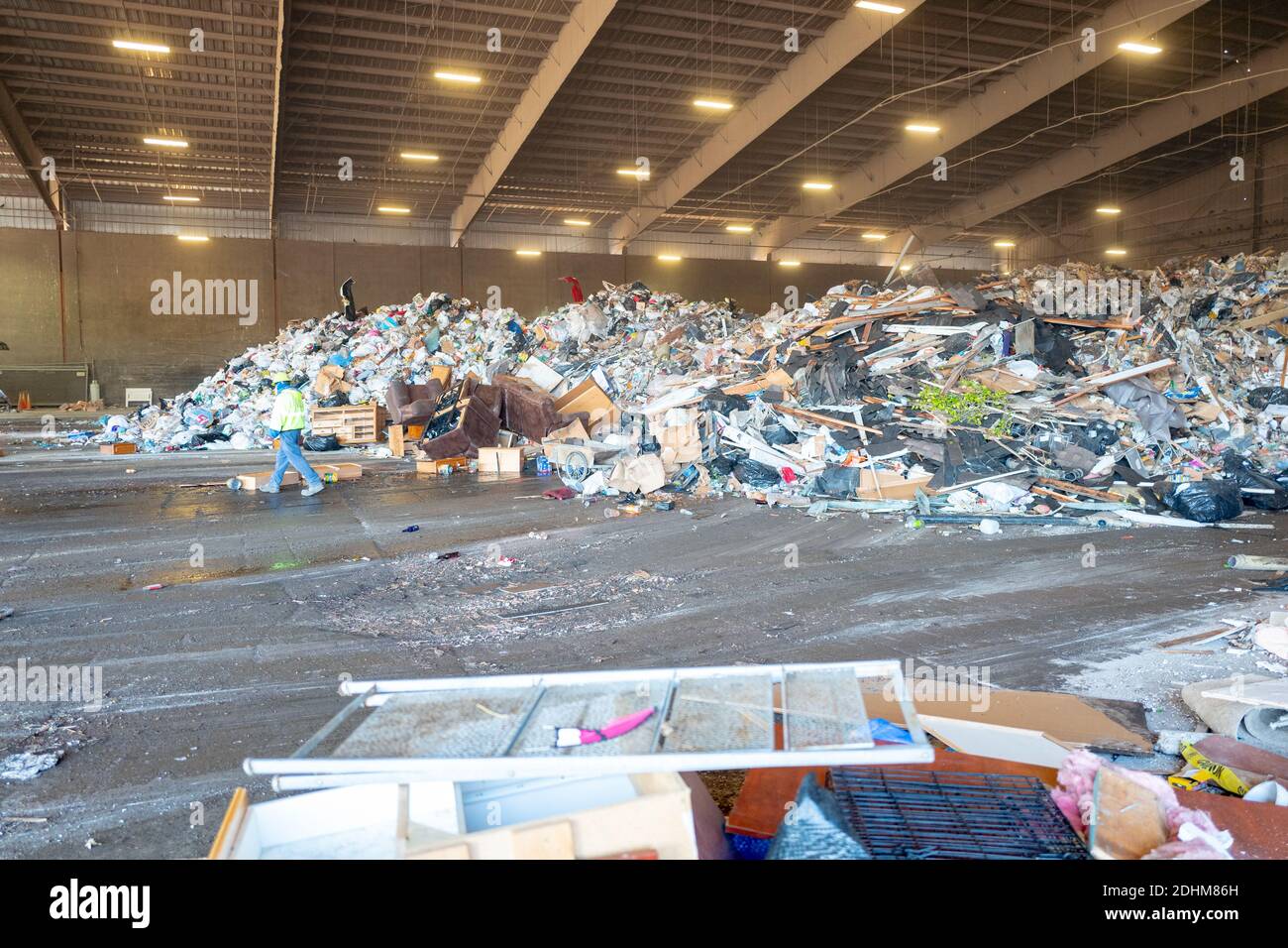 Large pile of municipal solid waste and garbage is visible at the ...