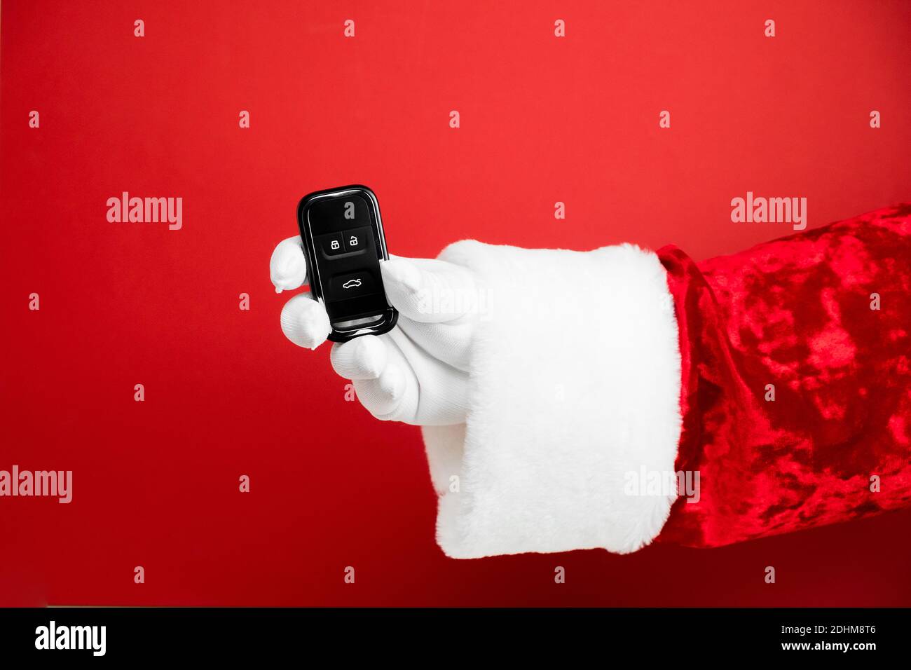 Santa Claus hand holds car keys. Merry Christmas and New Year concept ...