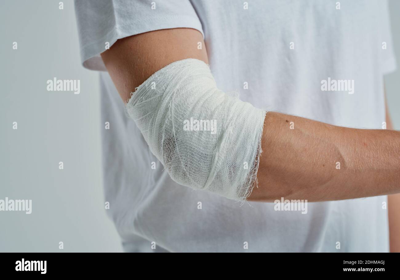 man with bandaged arm elbow and finger injury medicine Stock Photo - Alamy