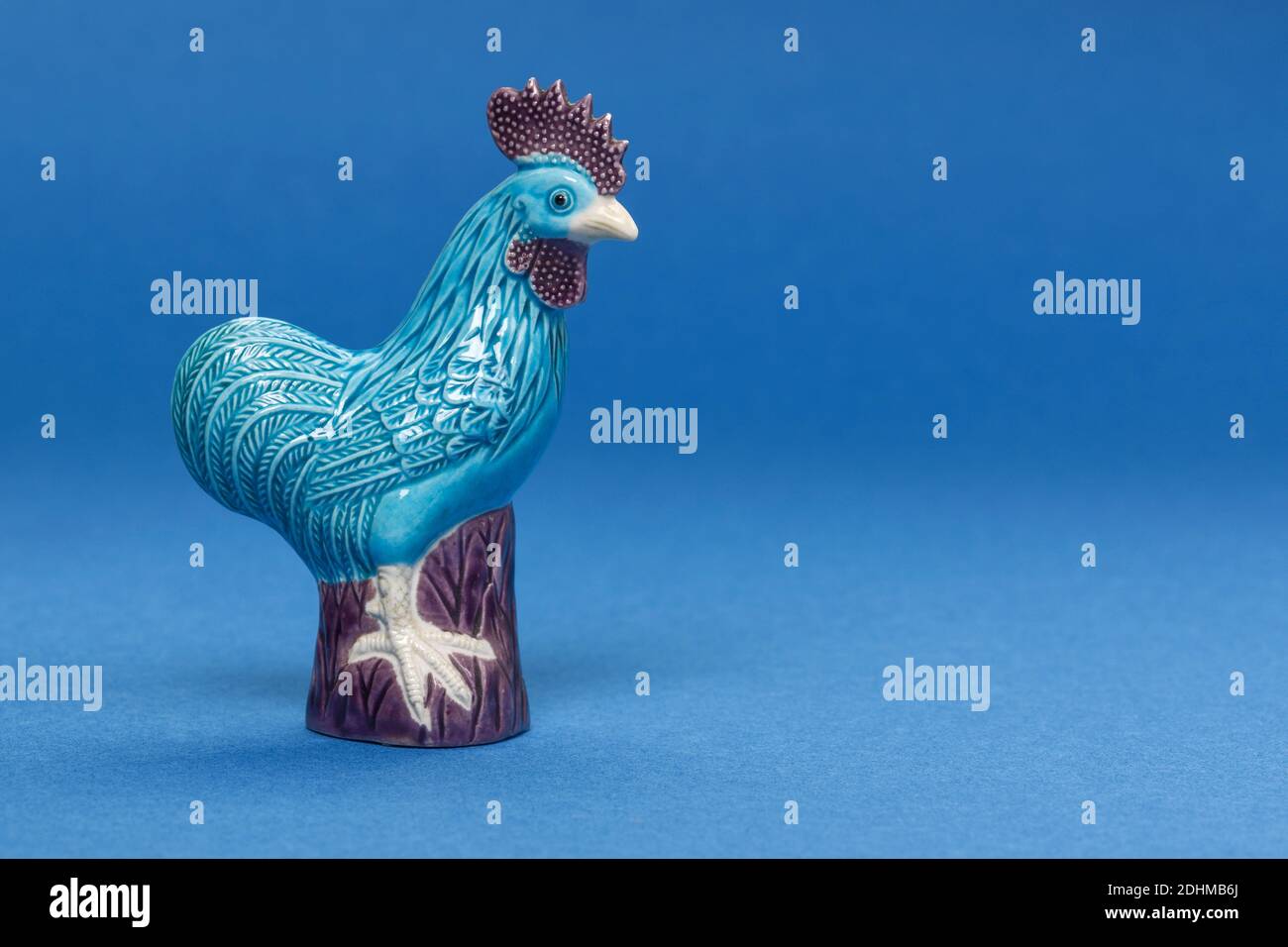 A ceramic blue cockerel bird ornament Stock Photo - Alamy