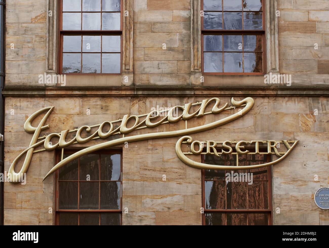 Glasgow architecture with vintage carved wooden gilt shop signage Stock ...