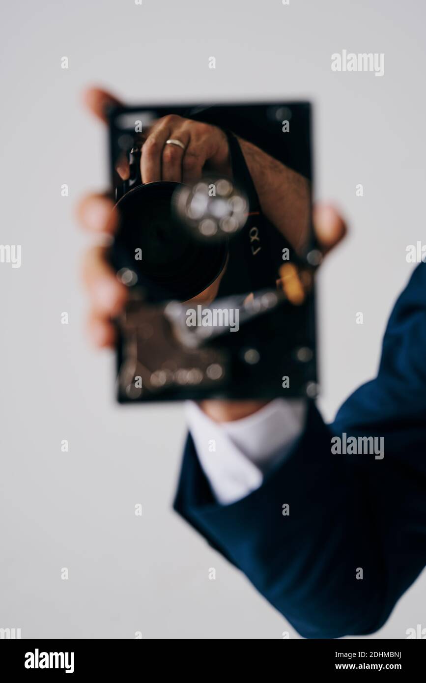 business man holding disassembled hard drive on gray background Stock ...