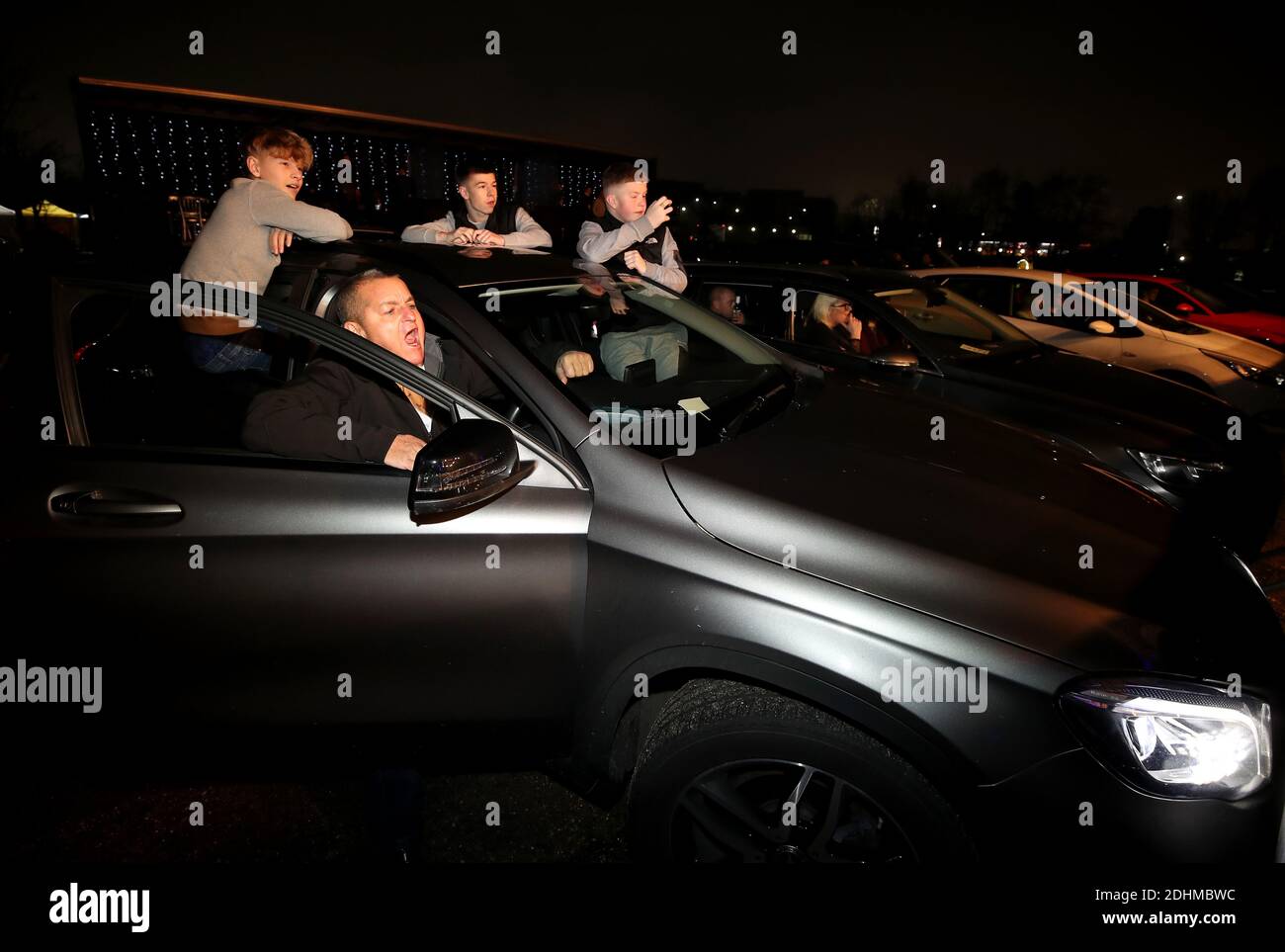 Spectators watch the action during the Drive-In Boxing event at the ...