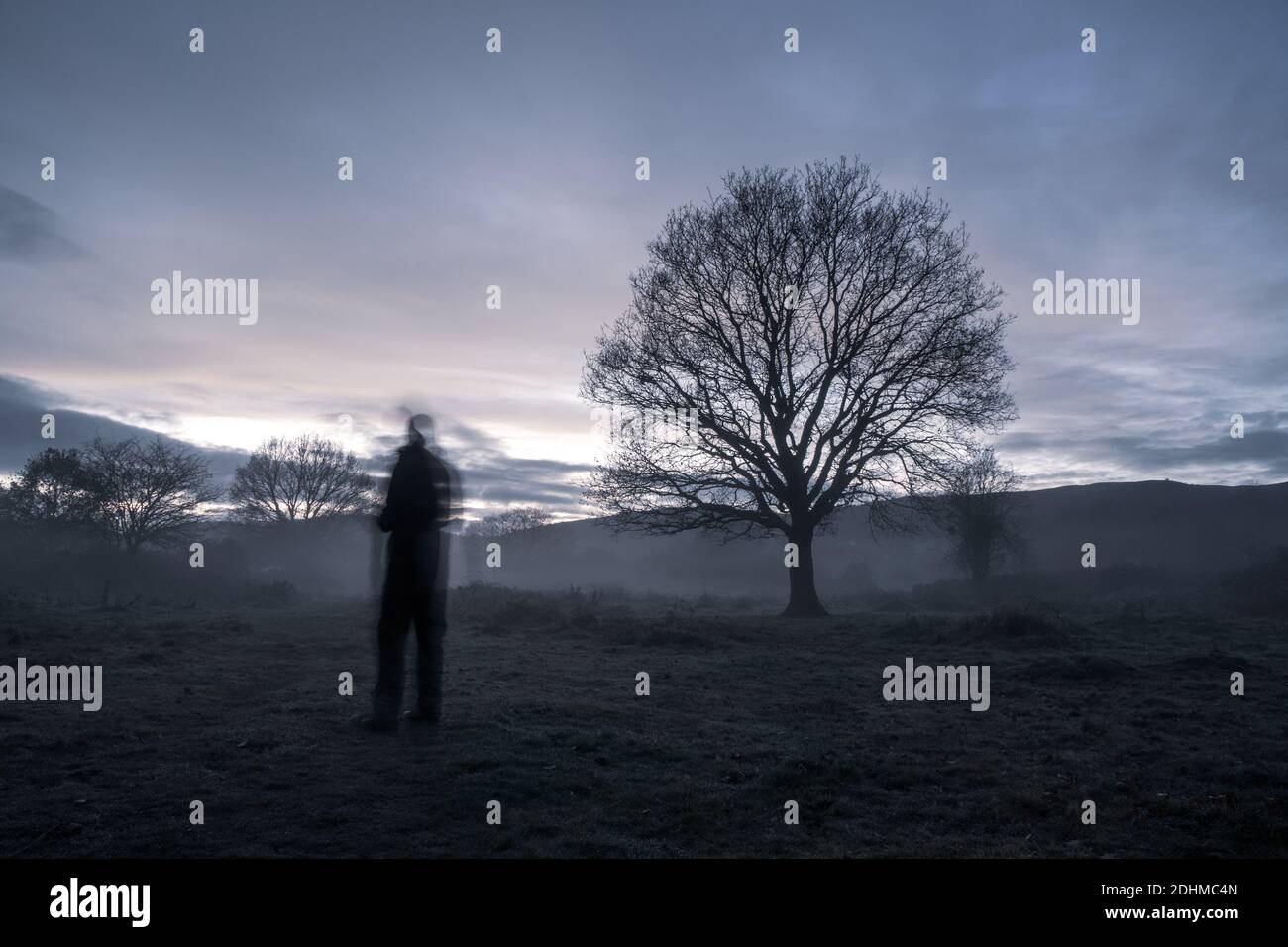 A blurred ghostly figure in the countryside on a moody atmospheric ...