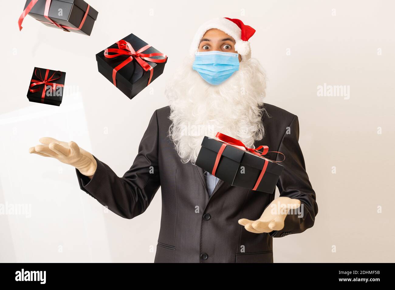 Real Santa Claus on background, wearing protective mask and with an ...