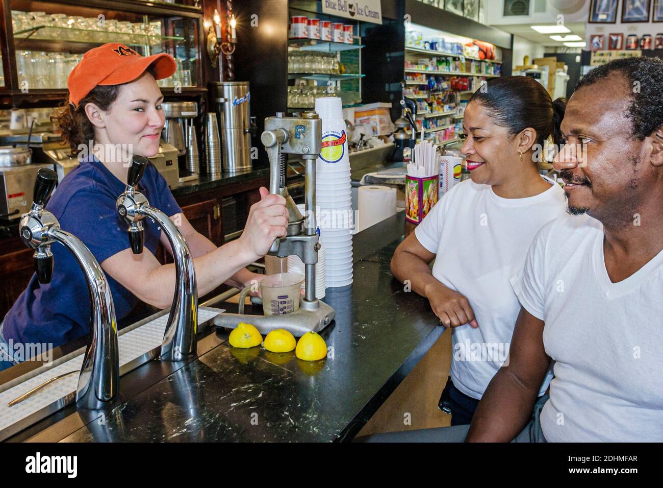 Black couple customers man woman female counter female employee hi-res ...