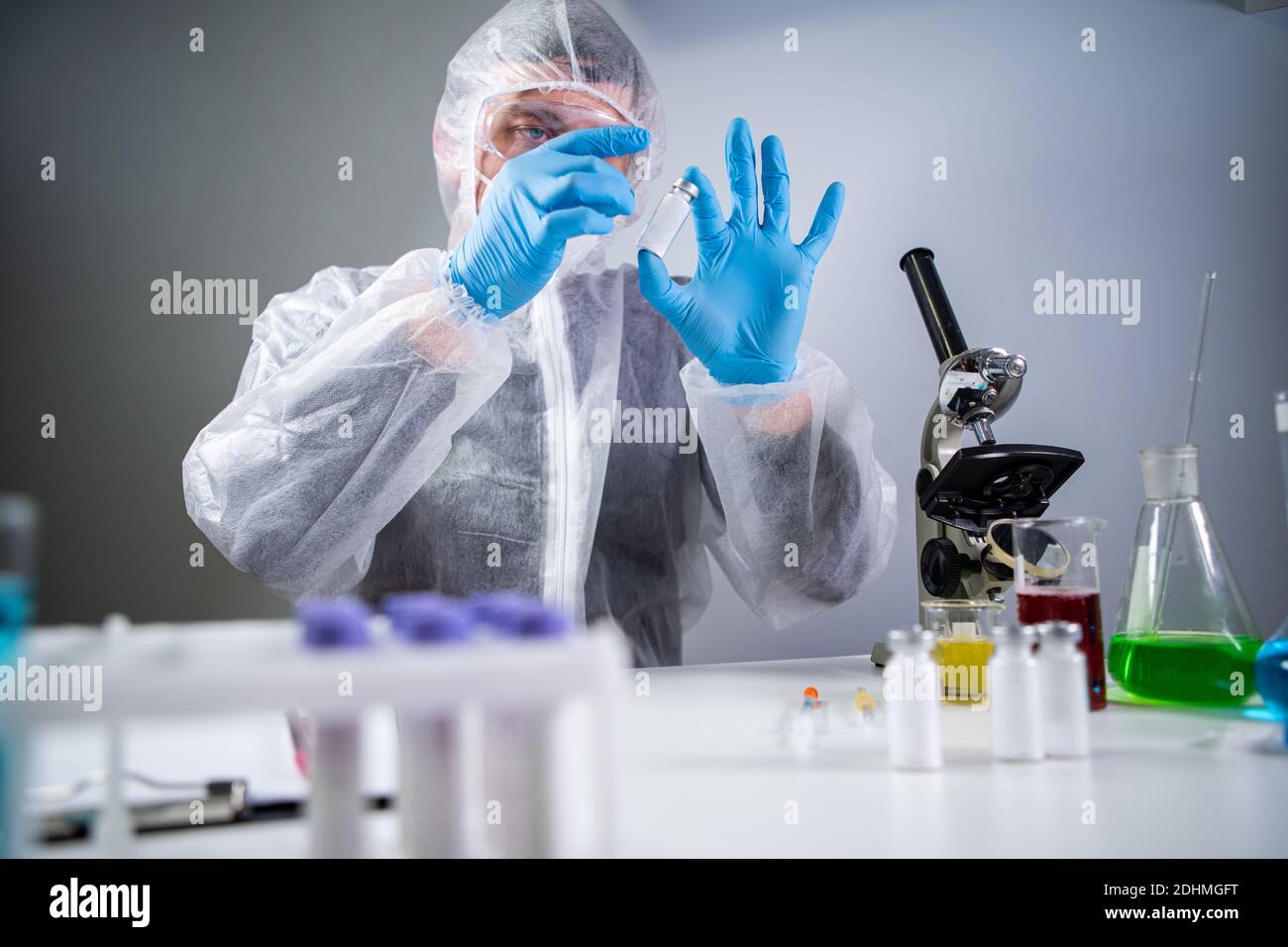 Development and search for drug for coronavirus. Chemist examining ...